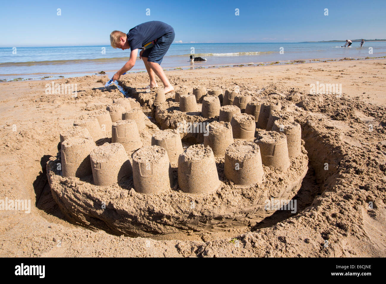 Sand castle on beach with moat hi-res stock photography and images - Alamy