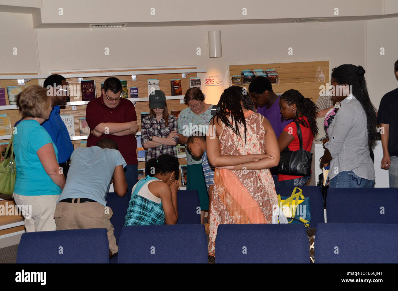 Group of people praying Stock Photo - Alamy