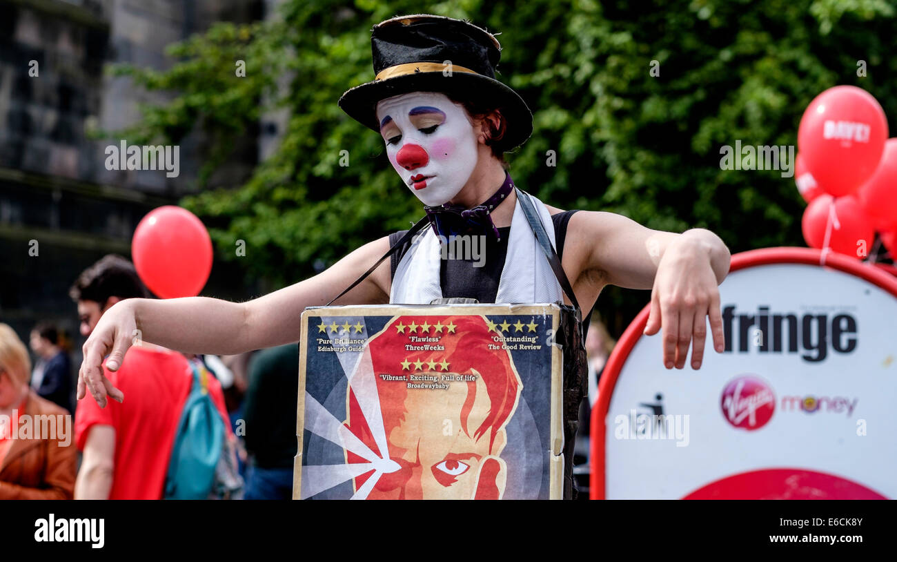 Fringe performers entertain and promote their show in the High Street ...