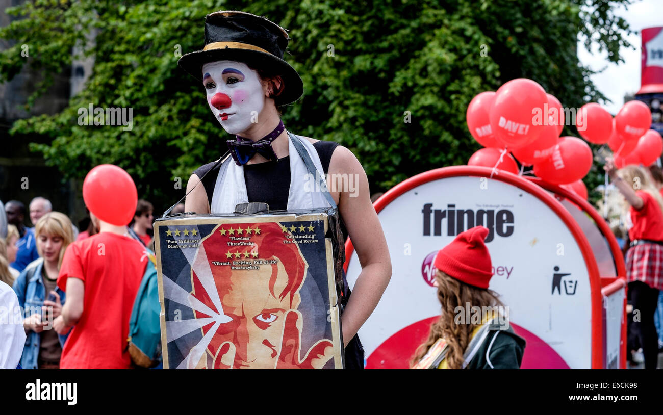 Fringe performers entertain and promote their show in the High Street ...