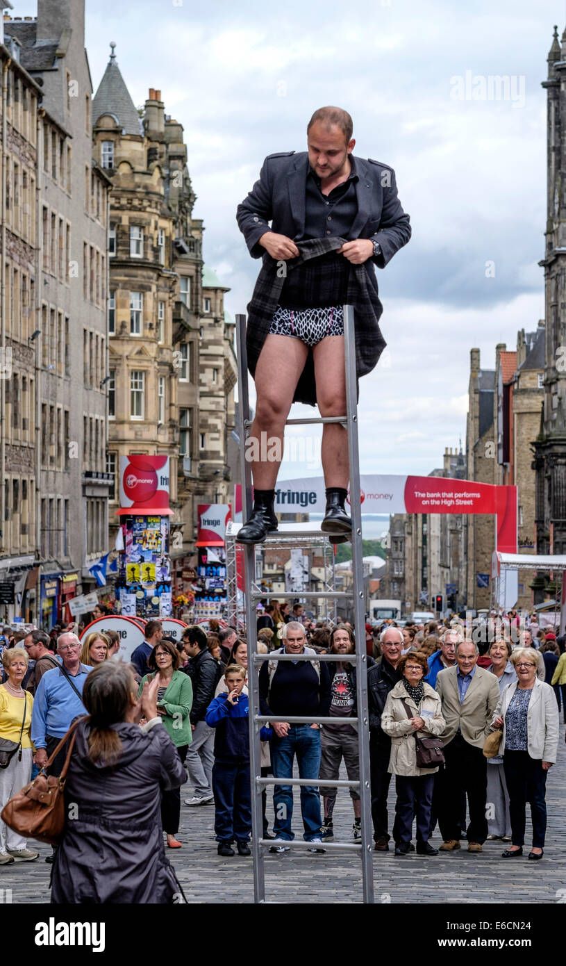 Open air ladder act kilt audience participation crowds hi-res stock ...