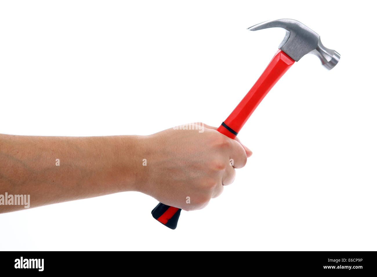 Hand holding a red hammer Stock Photo - Alamy