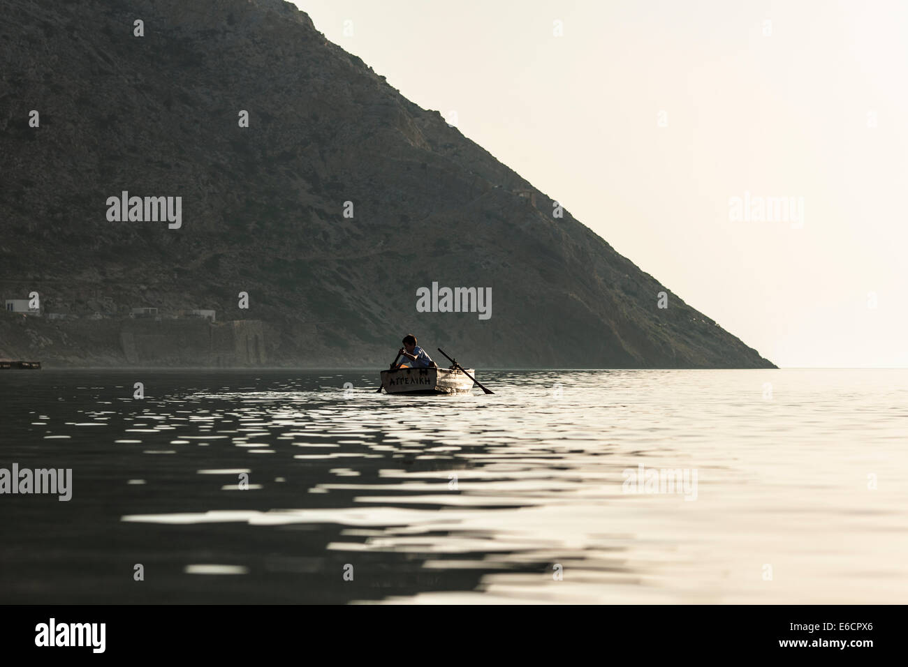 Boy alone in his boat Stock Photo - Alamy