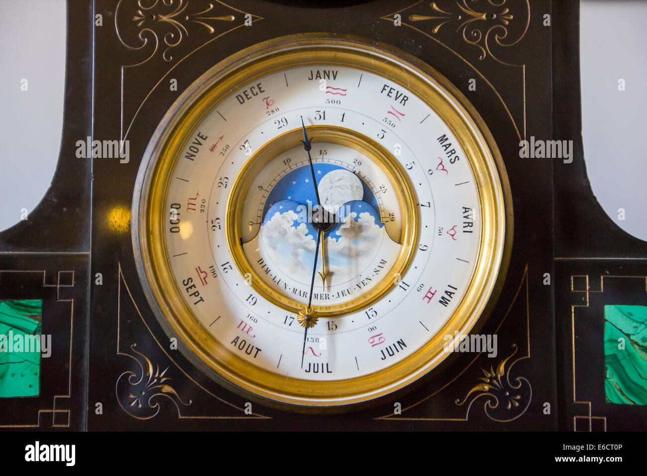 An old clock that also tells the day of the year and the phase of the ...