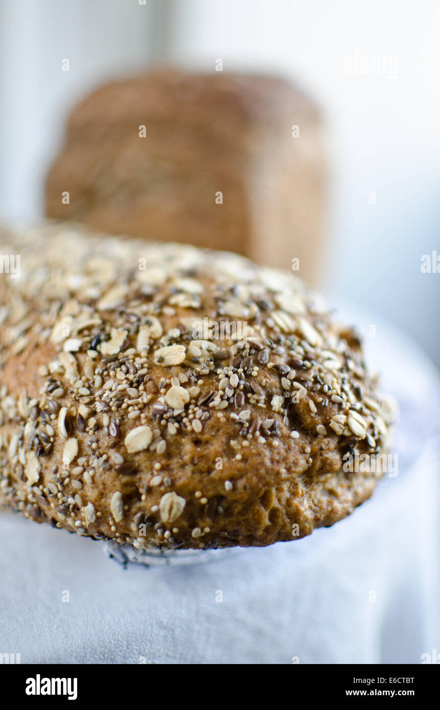 Pieces of homemade wholemeal bread over wooden table Stock Photo - Alamy