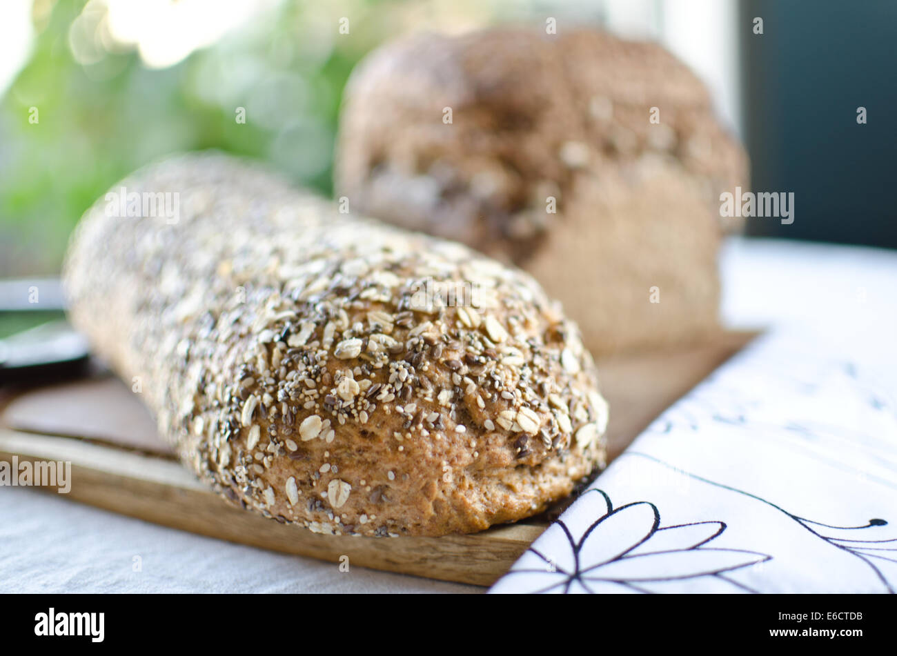 Pieces of homemade wholemeal bread over wooden table Stock Photo - Alamy