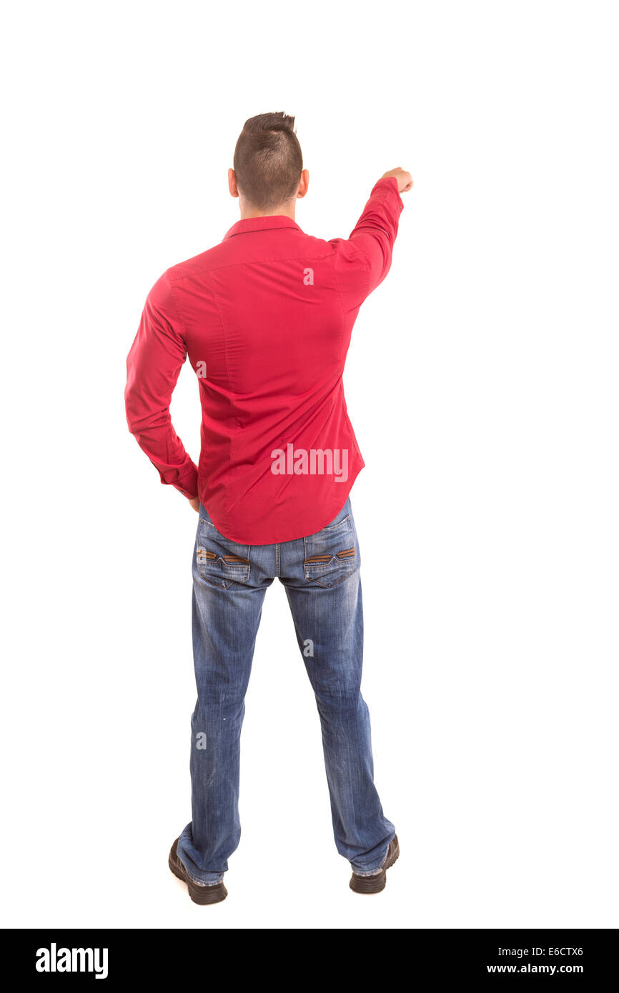 A young man with his back turned to camera, pointing to something Stock ...