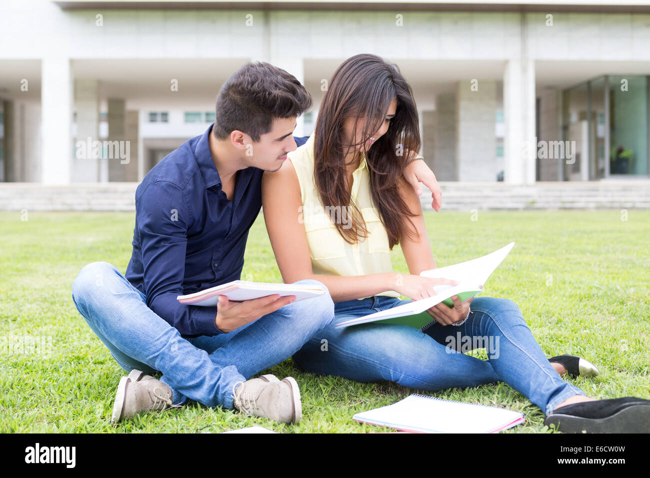 Couple of happy students at the university campus Stock Photo - Alamy