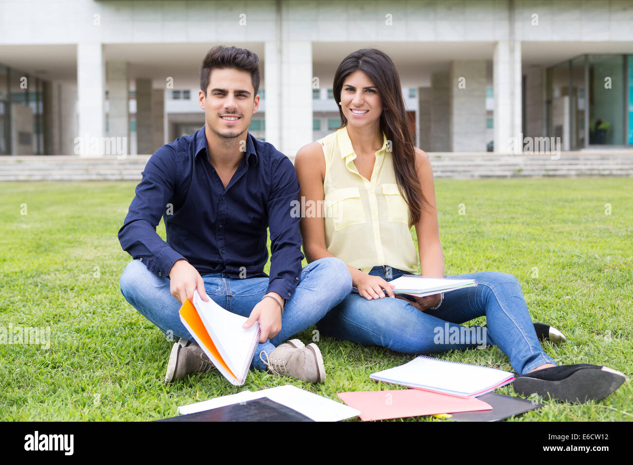 Couple of happy students at the university campus Stock Photo - Alamy