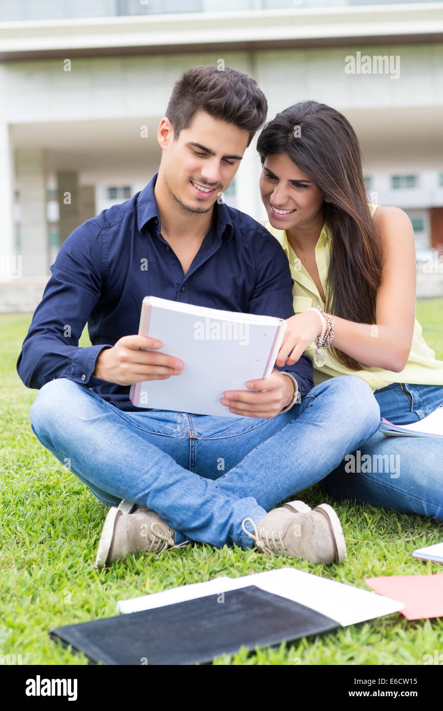 Couple of happy students at the university campus Stock Photo - Alamy