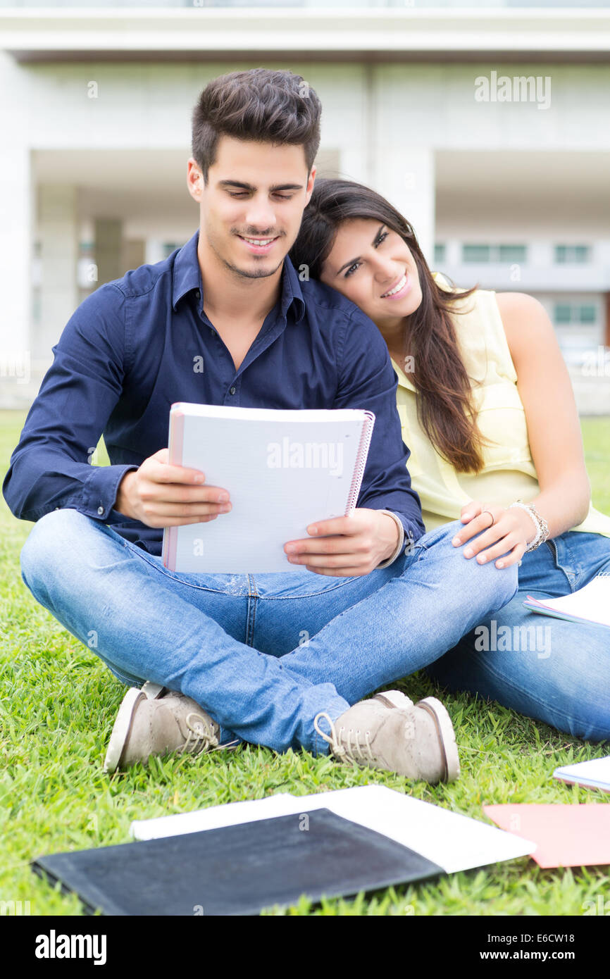 Couple of happy students at the university campus Stock Photo - Alamy
