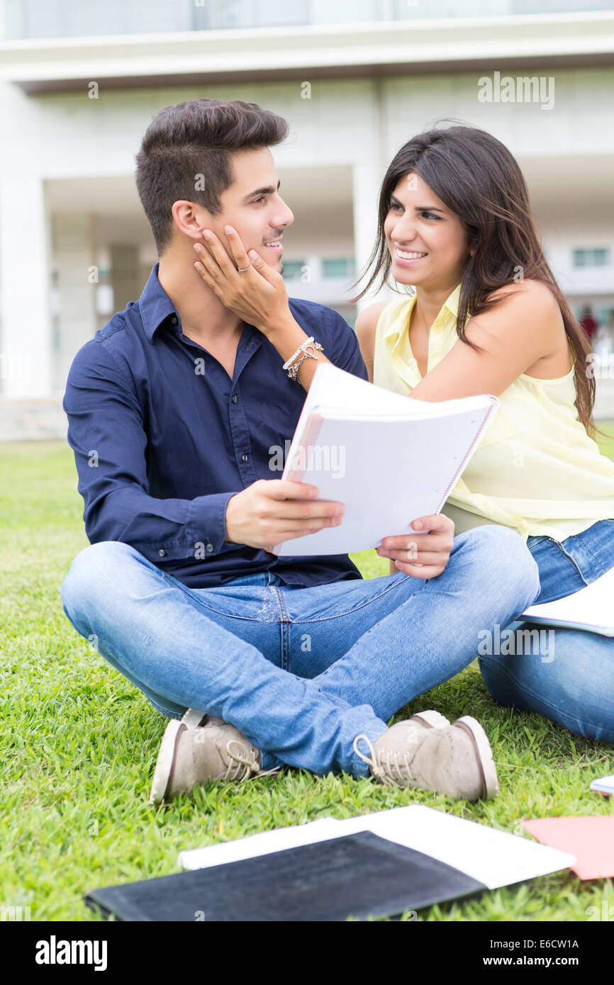 Couple of happy students at the university campus Stock Photo - Alamy