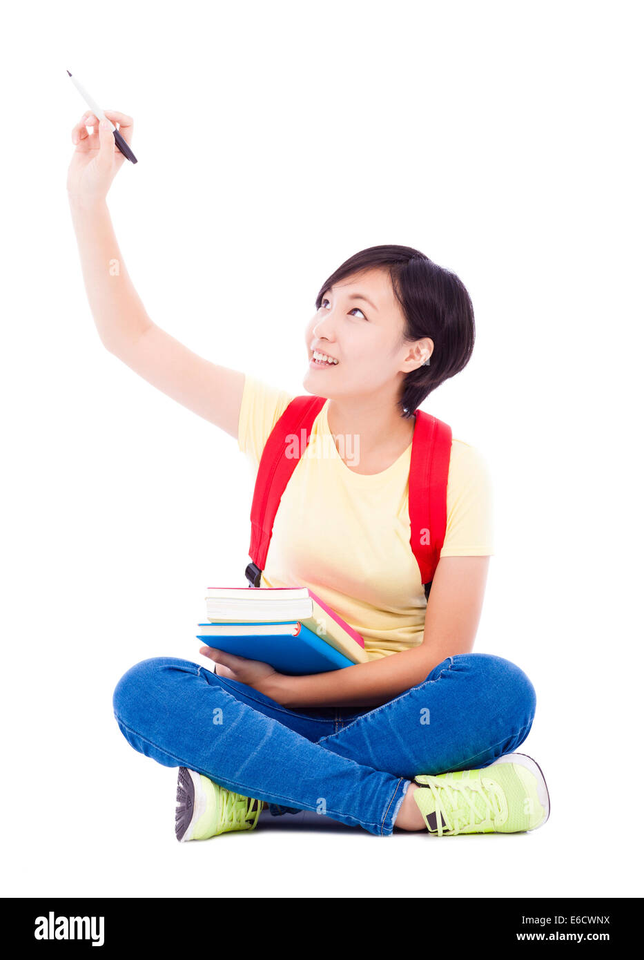 beautiful student asian girl sitting on floor and drawing over white ...