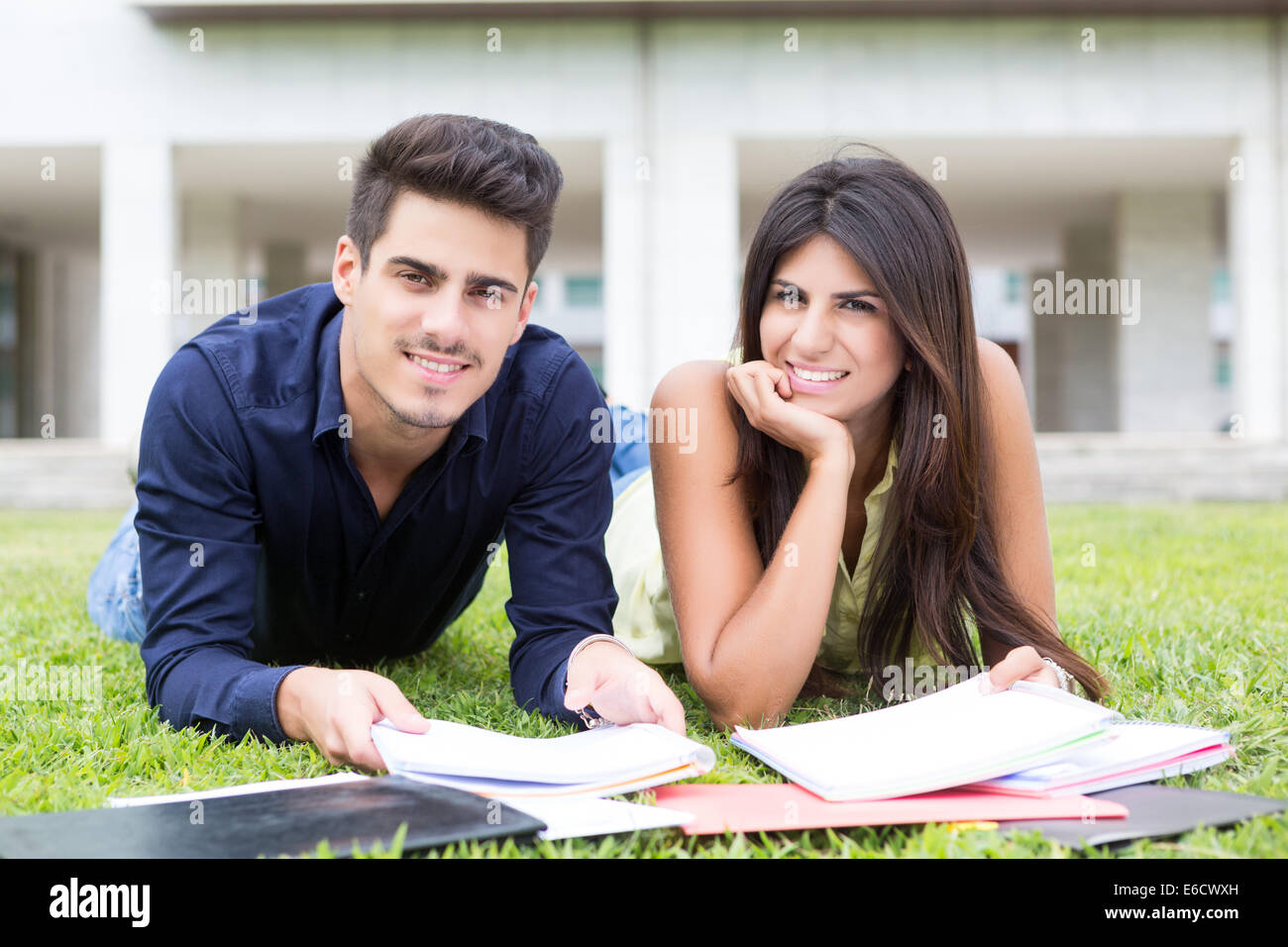 Couple of happy students at the university campus Stock Photo - Alamy