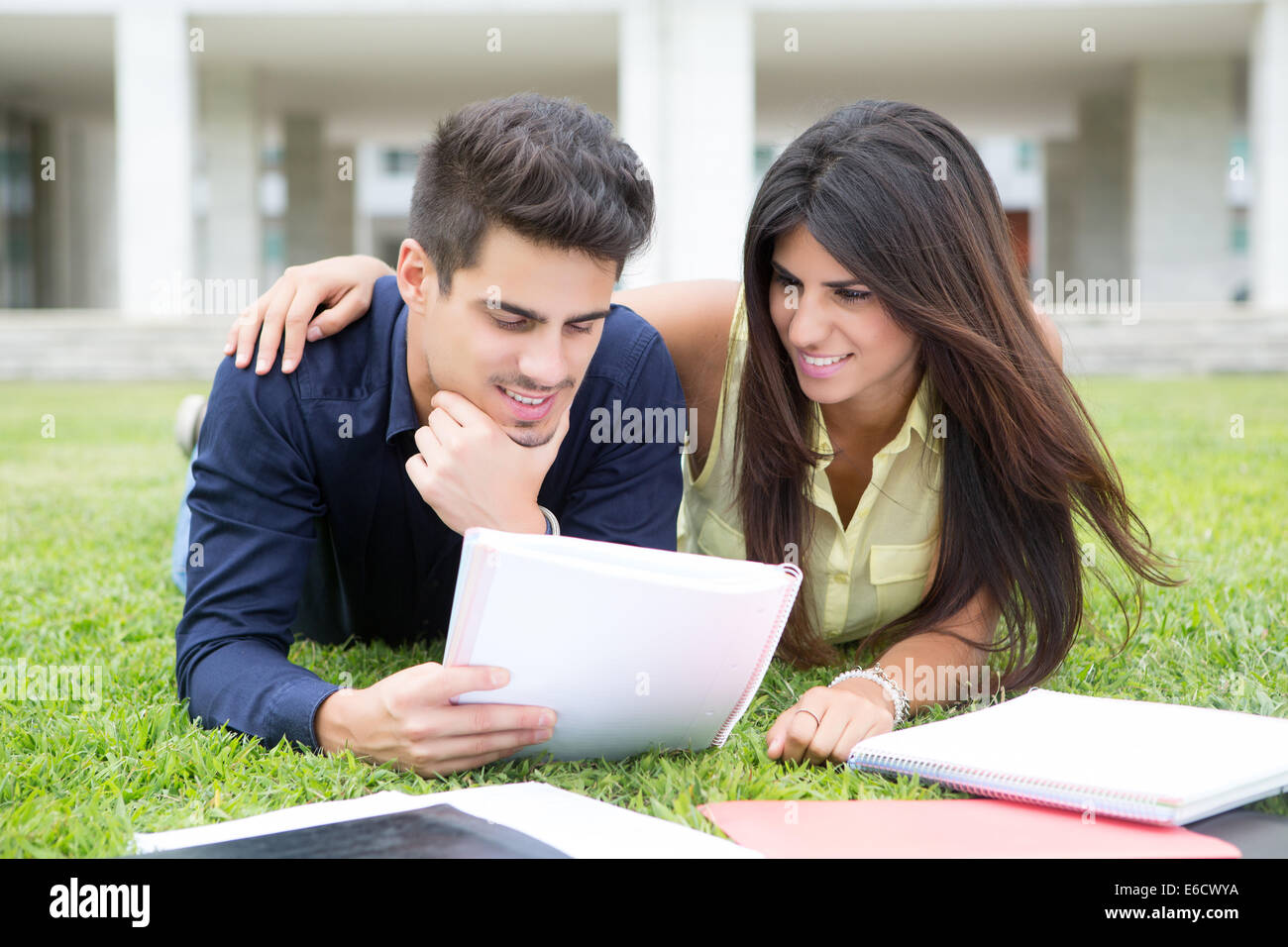 Couple of happy students at the university campus Stock Photo - Alamy