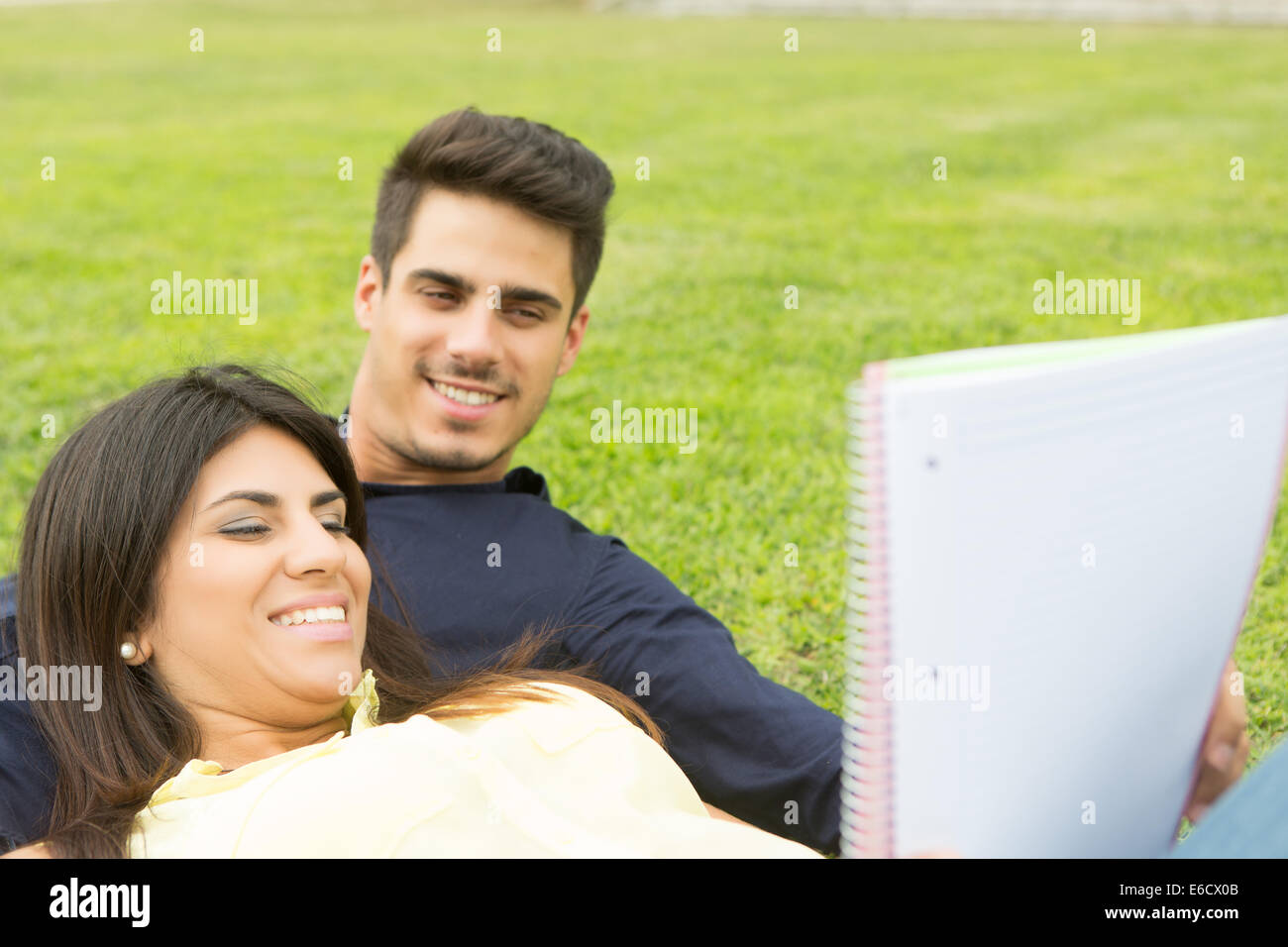 Couple of happy students at the university campus Stock Photo - Alamy