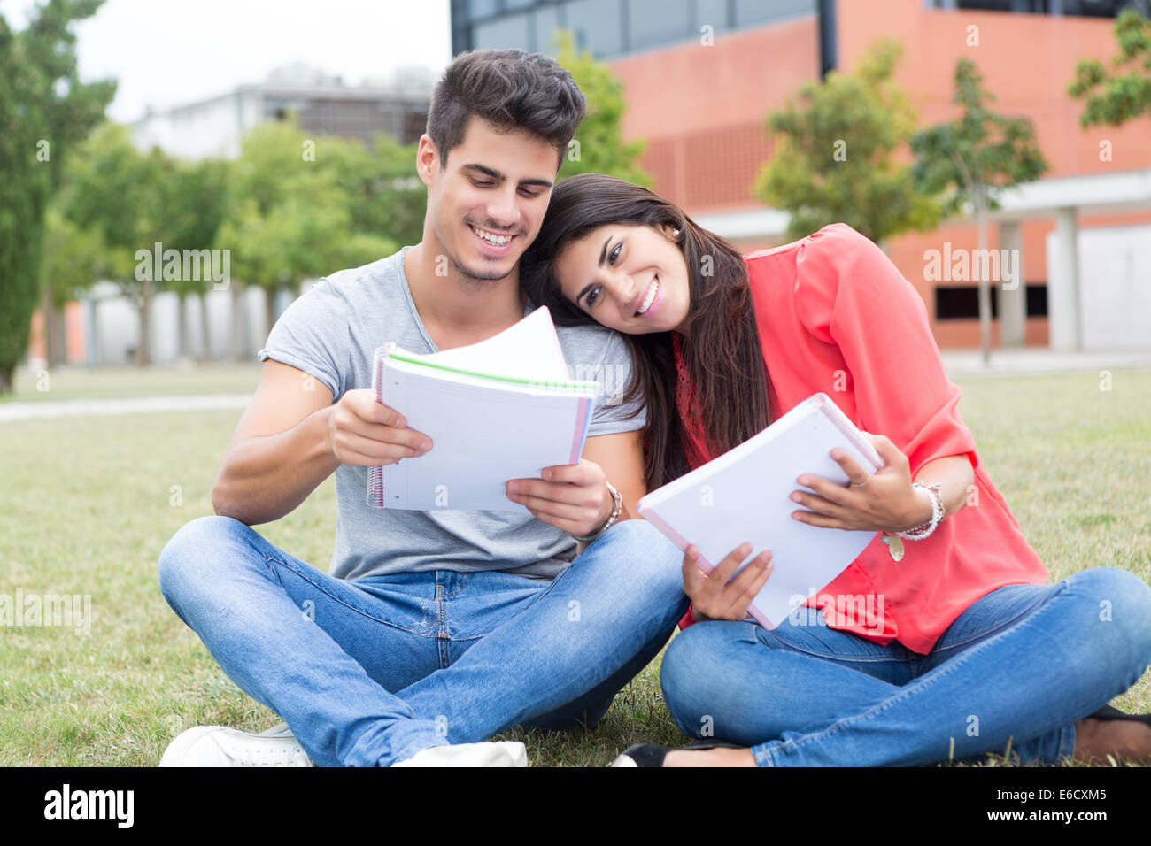 Couple of happy students at the university campus Stock Photo - Alamy