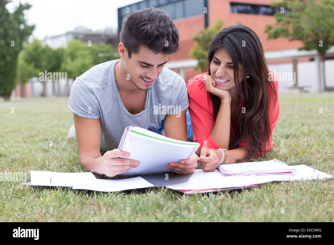Couple of happy students at the university campus Stock Photo - Alamy