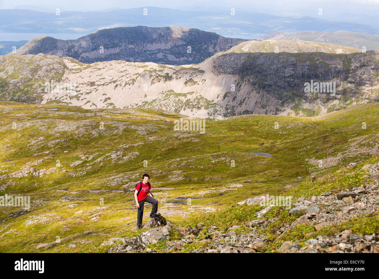 A teenager climbing the Munro on Ben More, Isle of Mull, Scotland, UK ...
