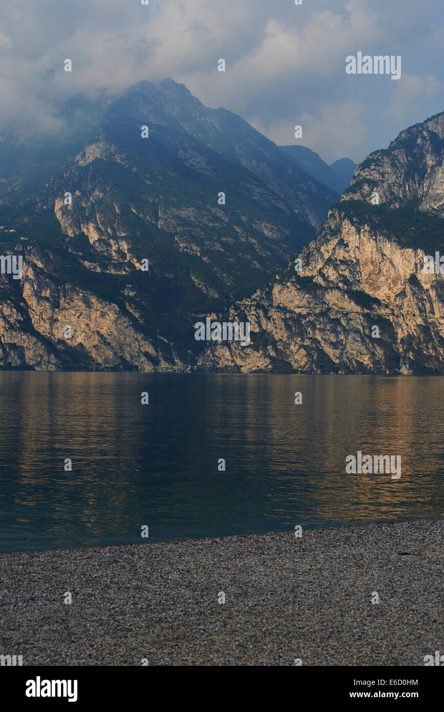 Lago di Garda pebble beach at dusk, Torbole, Lake Garda, Italian Lakes ...