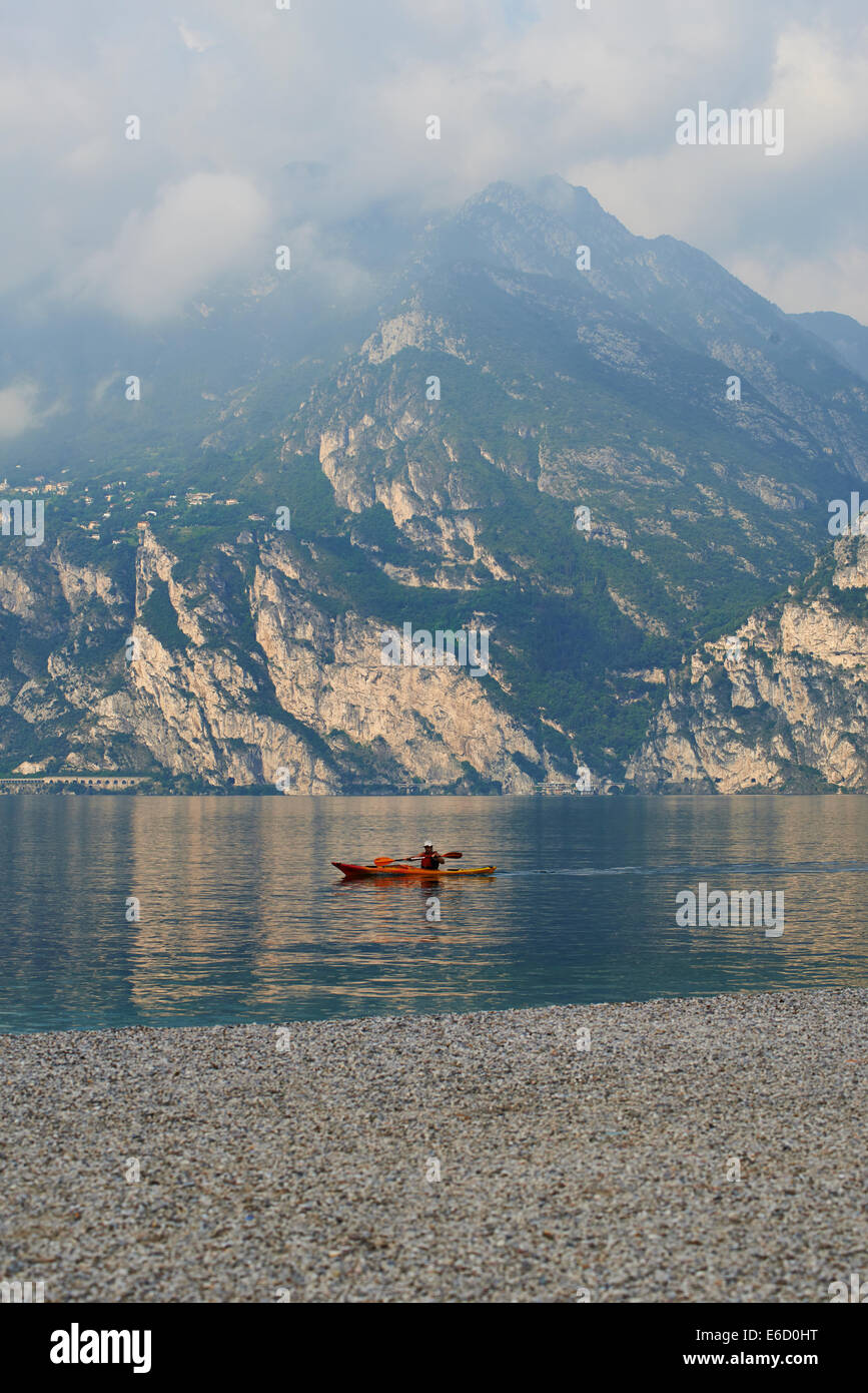 Lago di Garda pebble beach at dusk, Torbole, Lake Garda, Italian Lakes ...