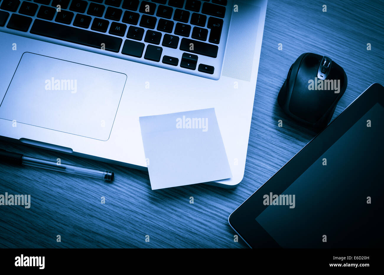 Modern desk with laptop and tablet Stock Photo - Alamy
