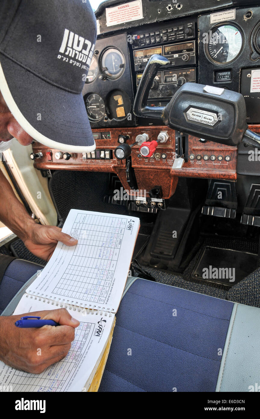 Pilot performs preflight checklist Stock Photo - Alamy