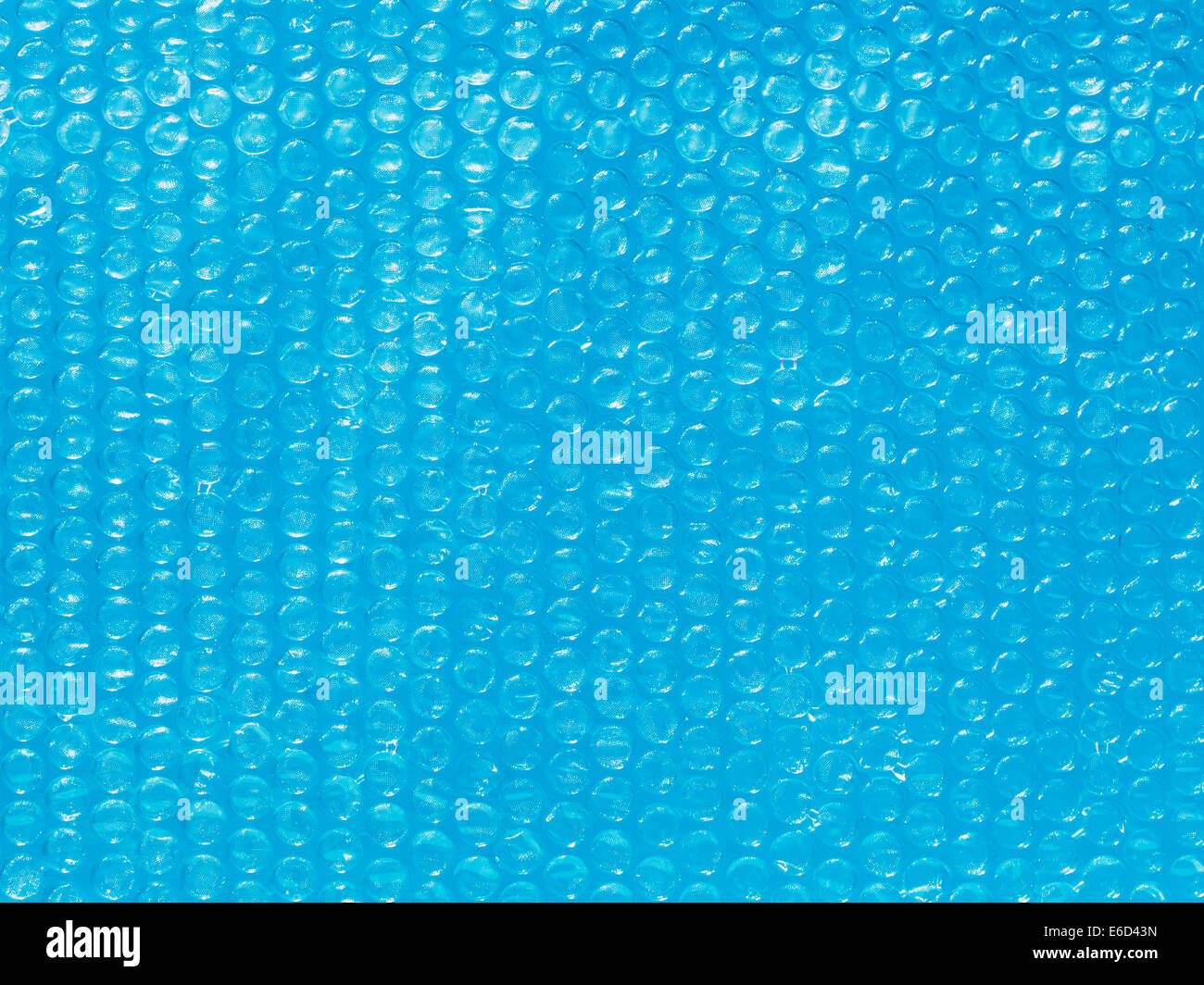 background from Bubble wrap film on blue water close up Stock Photo - Alamy