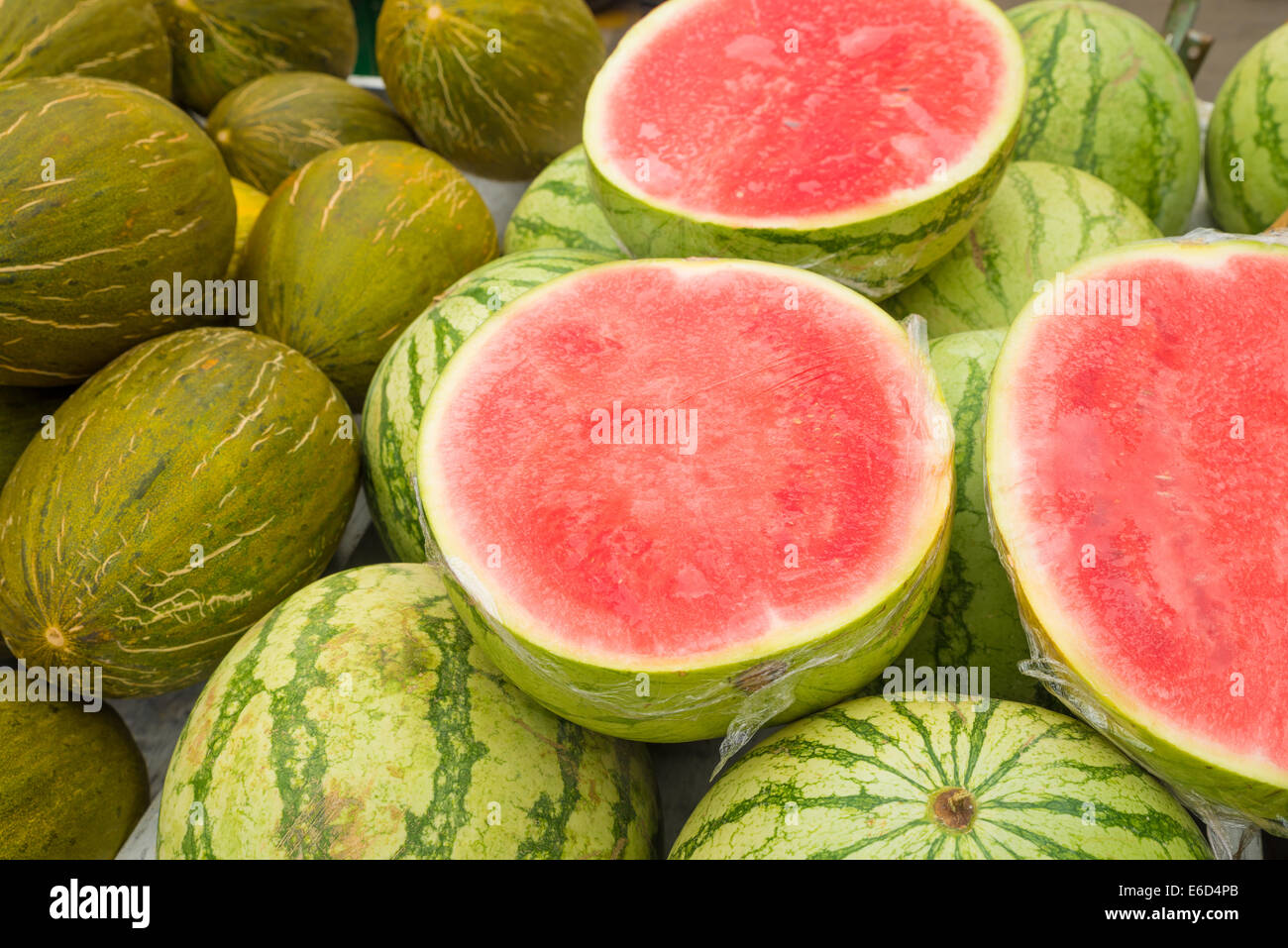 Assorted fresh melons on a street market stall Stock Photo - Alamy