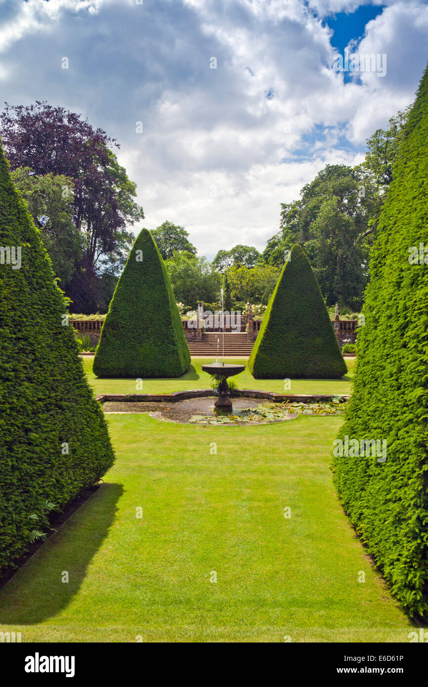 Clipped yew trees in the sunken garden of the Great Court at ...