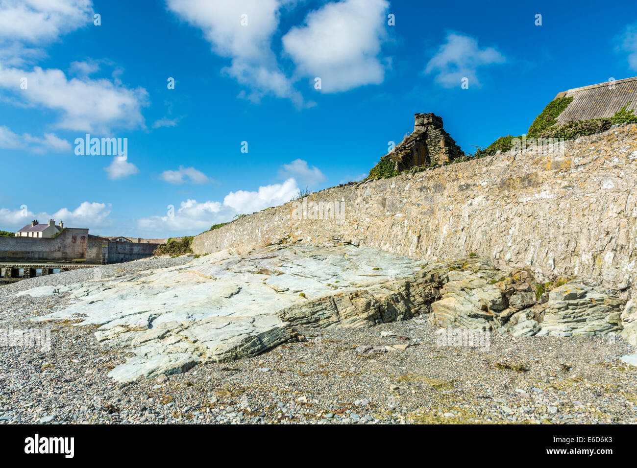 Buildings viewed from beach at Cemlyn Bay, Anglesey, North Wales, Uk ...
