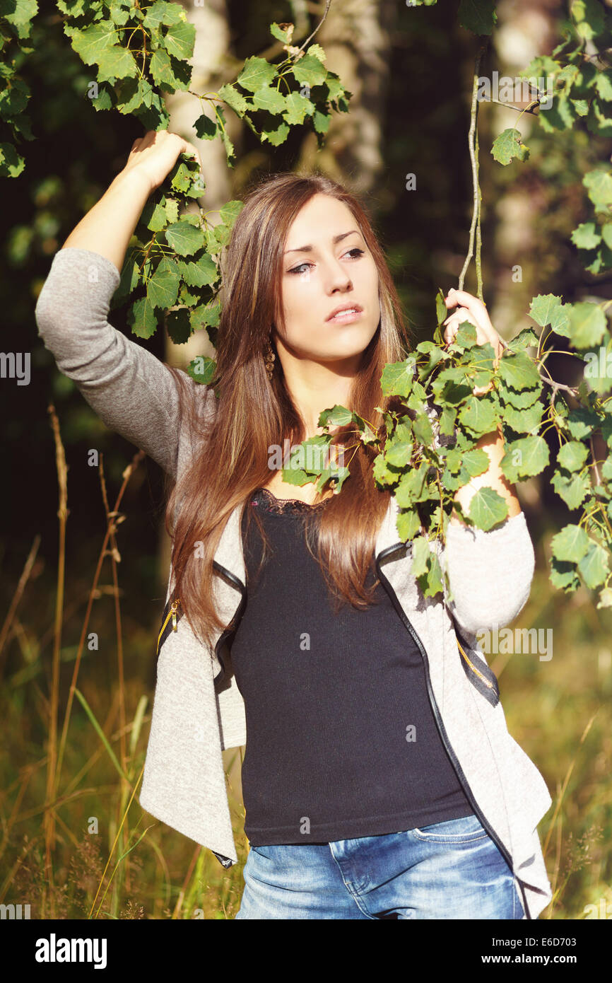 Portrait of a charming lady woman girl outdoor with forrest in ...