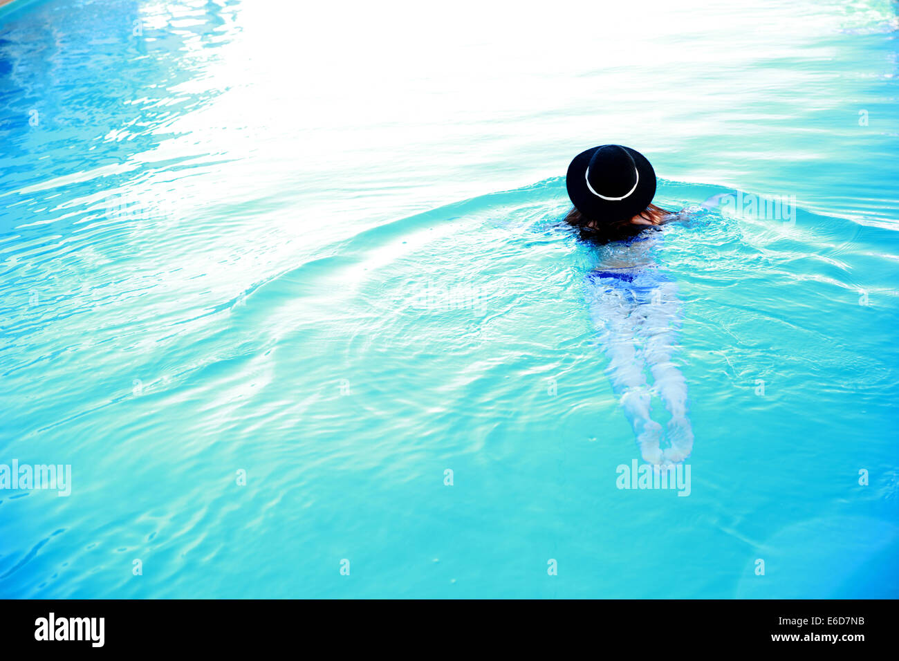 Back view portrait of a woman swimming in the pool Stock Photo - Alamy