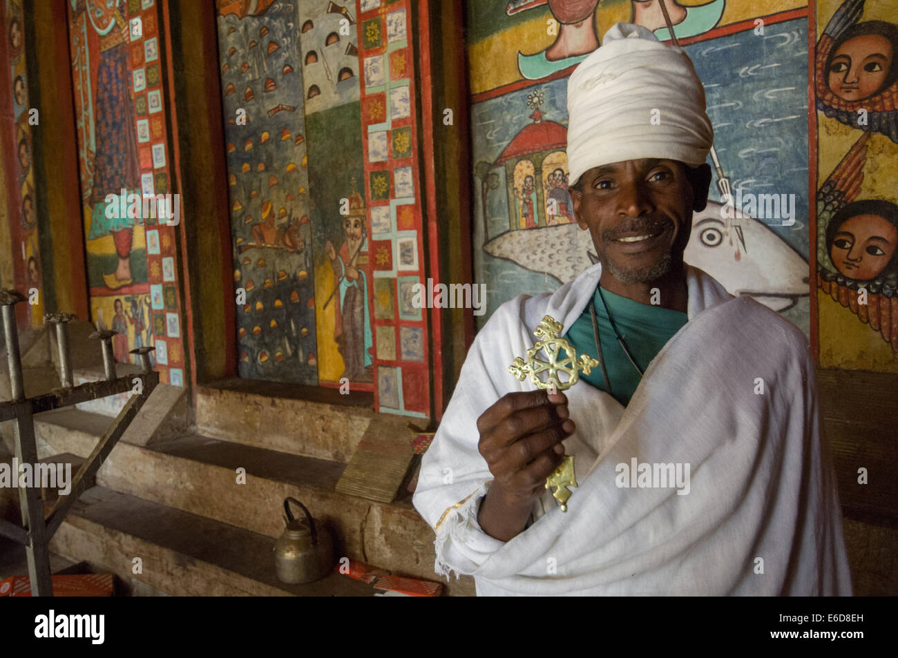 Priest holding a small Ethiopian cross, church of Narga Selassie, Dek ...