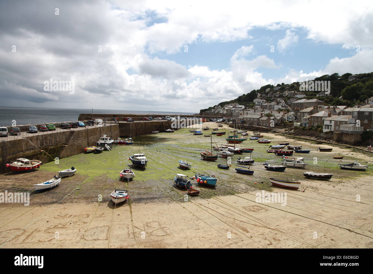 A flotilla of small fishing boats in Mousehole harbour waiting for the ...
