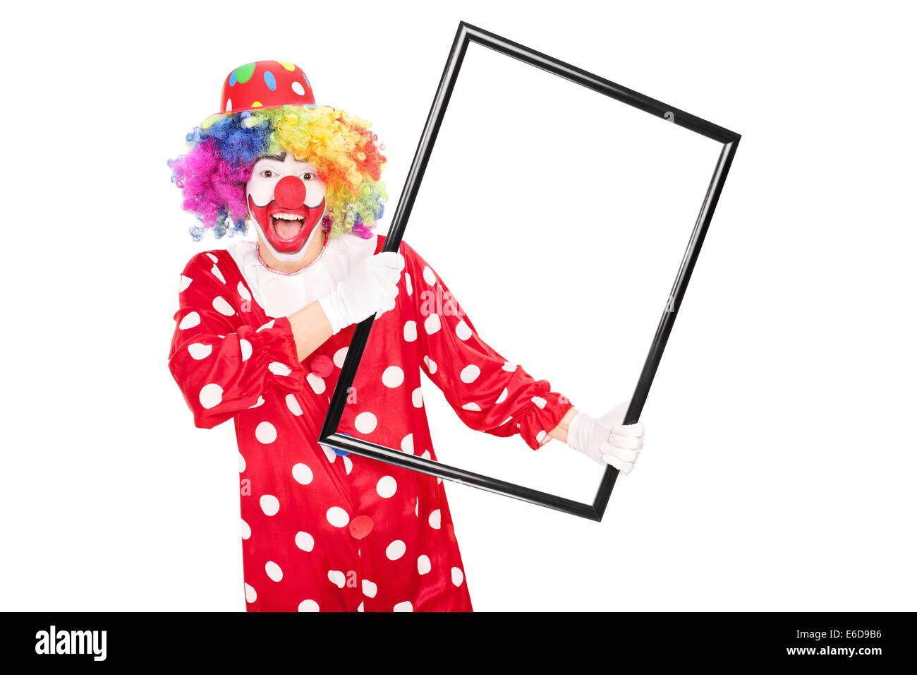 Excited clown holding a big picture frame Stock Photo - Alamy