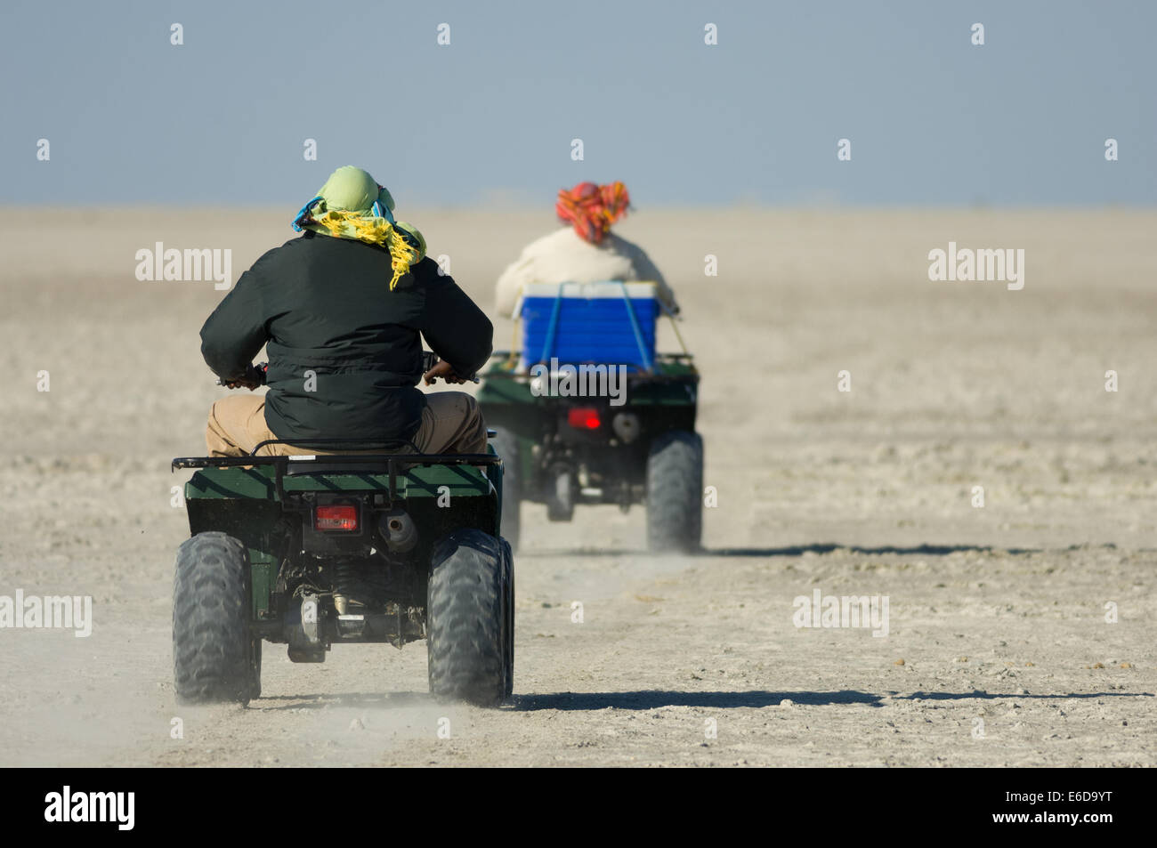 Safari guides riding quad bikes across the Makgadikgadi Pan, near Jack ...