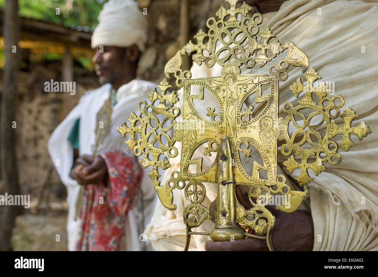 Priests holding Ethiopian crosses outside of the church of Narga ...