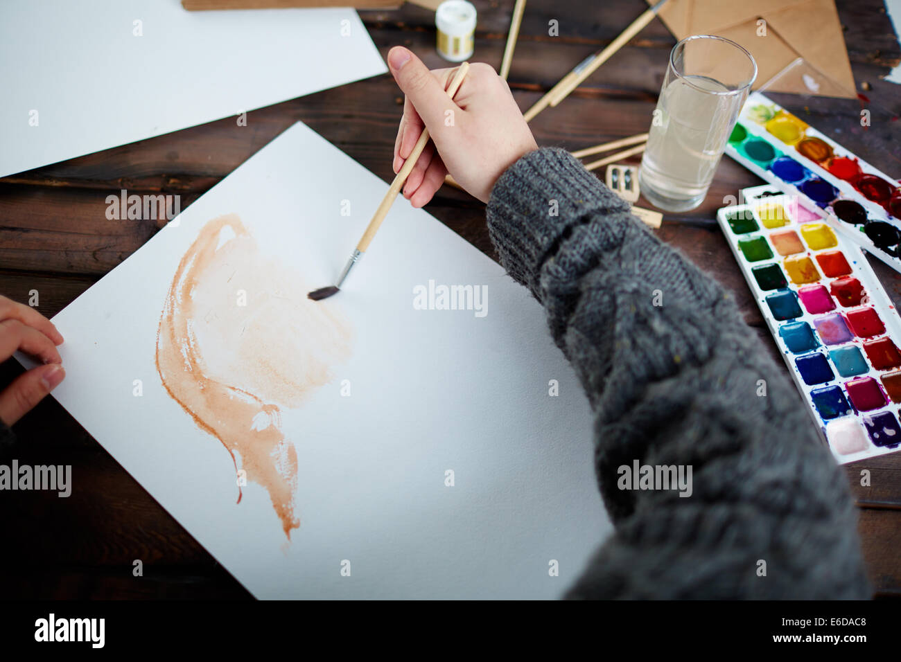 Close-up of male hand drawing with water-colors on paper Stock Photo ...