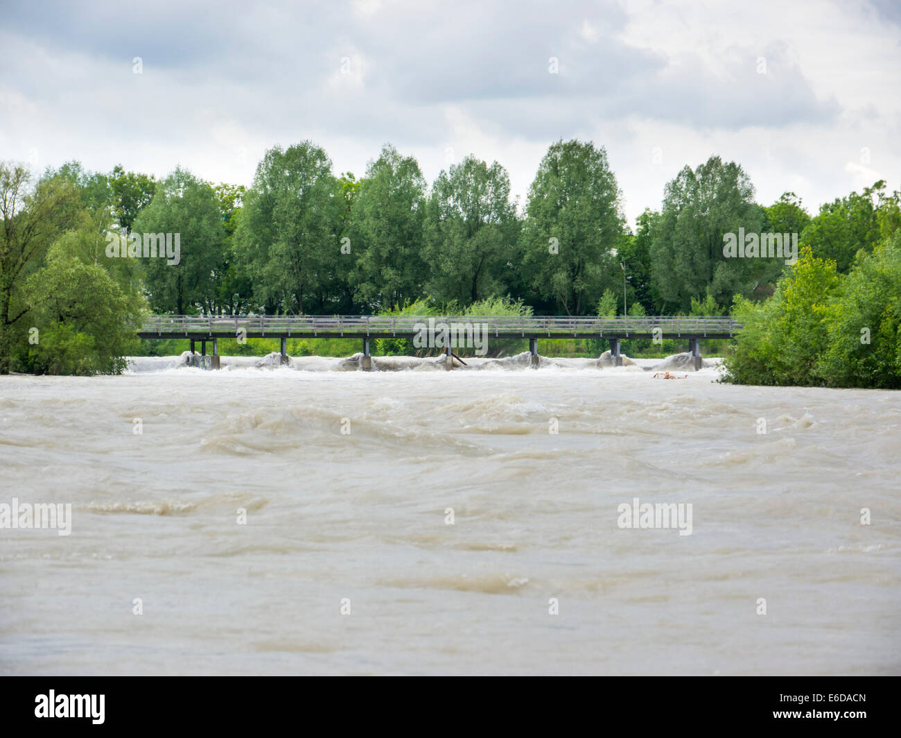 Germany, Bavaria, Munich, Bridge with flooded River Isar Stock Photo ...