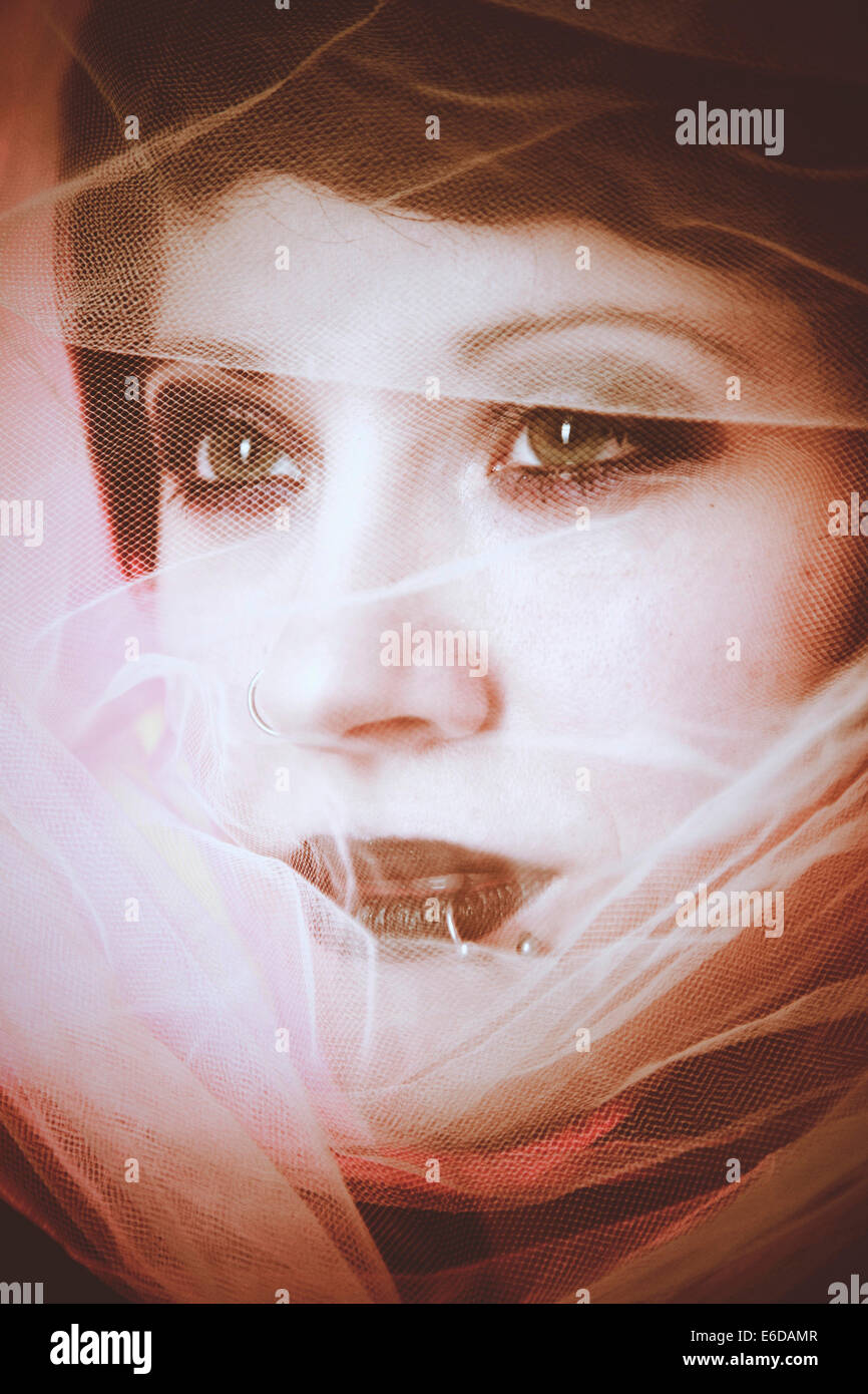 Portrait of young woman with veil and piercings, partial view Stock ...