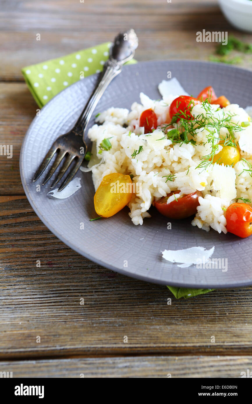 rice with parmesan cheese and tomatoes, food closeup Stock Photo - Alamy