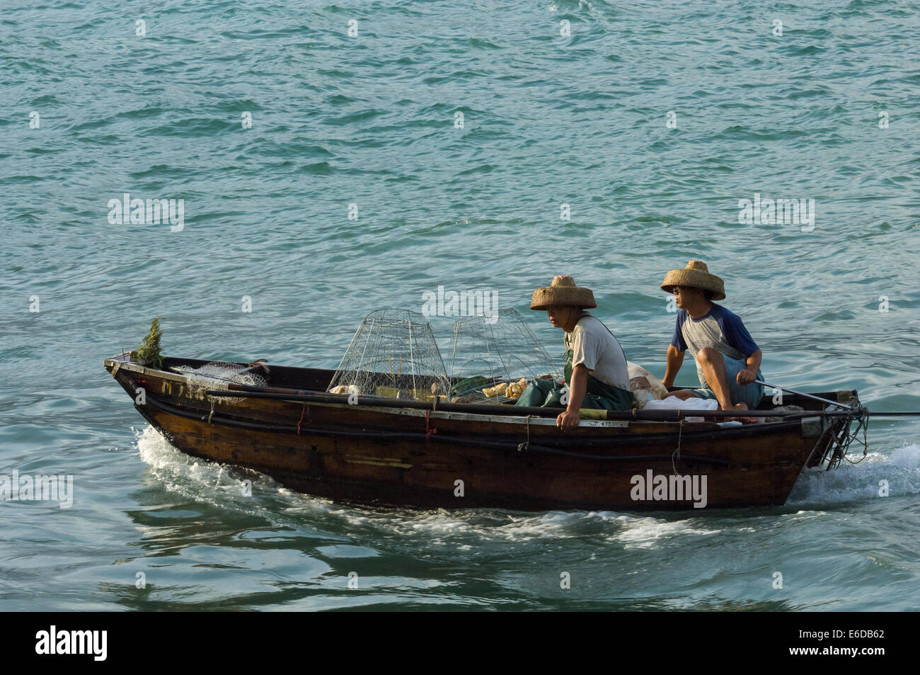 Fishermen in a traditional bumboat fishing boat, Causeway Bay, Hong ...