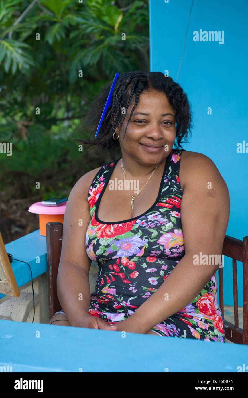 Local woman sitting on her verandah in the Village of St John's ...