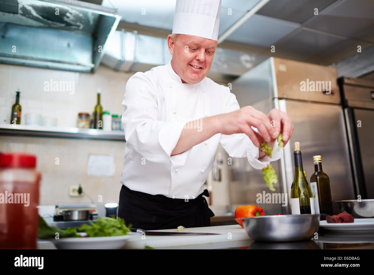 Professional cook making some dish Stock Photo - Alamy