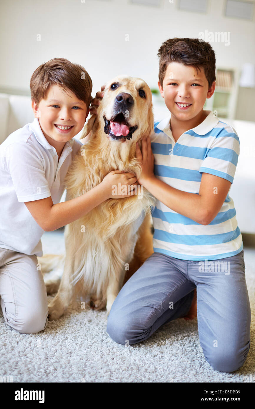 Portrait of two boys with a dog Stock Photo - Alamy
