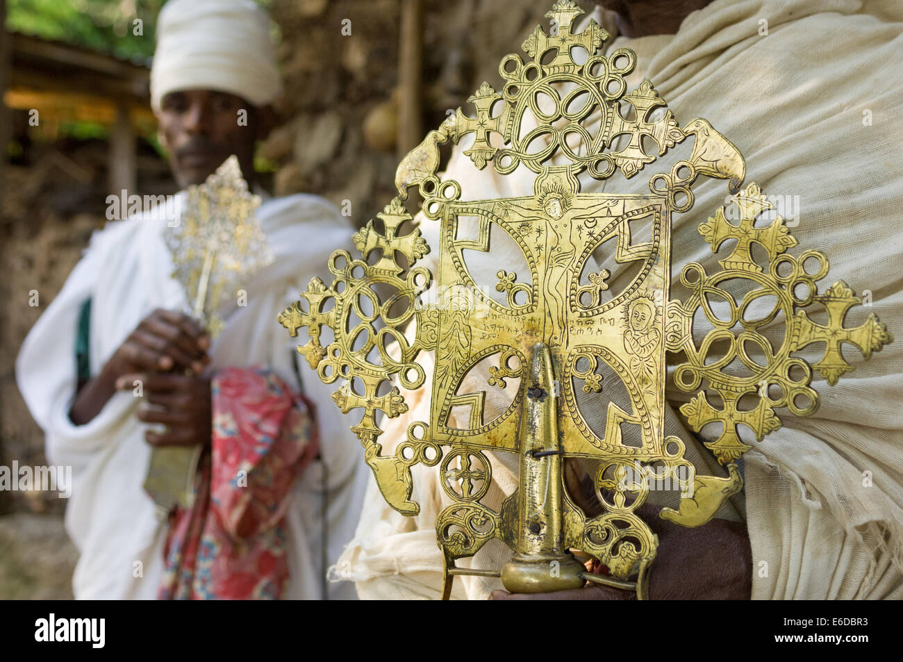 Priests holding Ethiopian crosses outside of the church of Narga ...