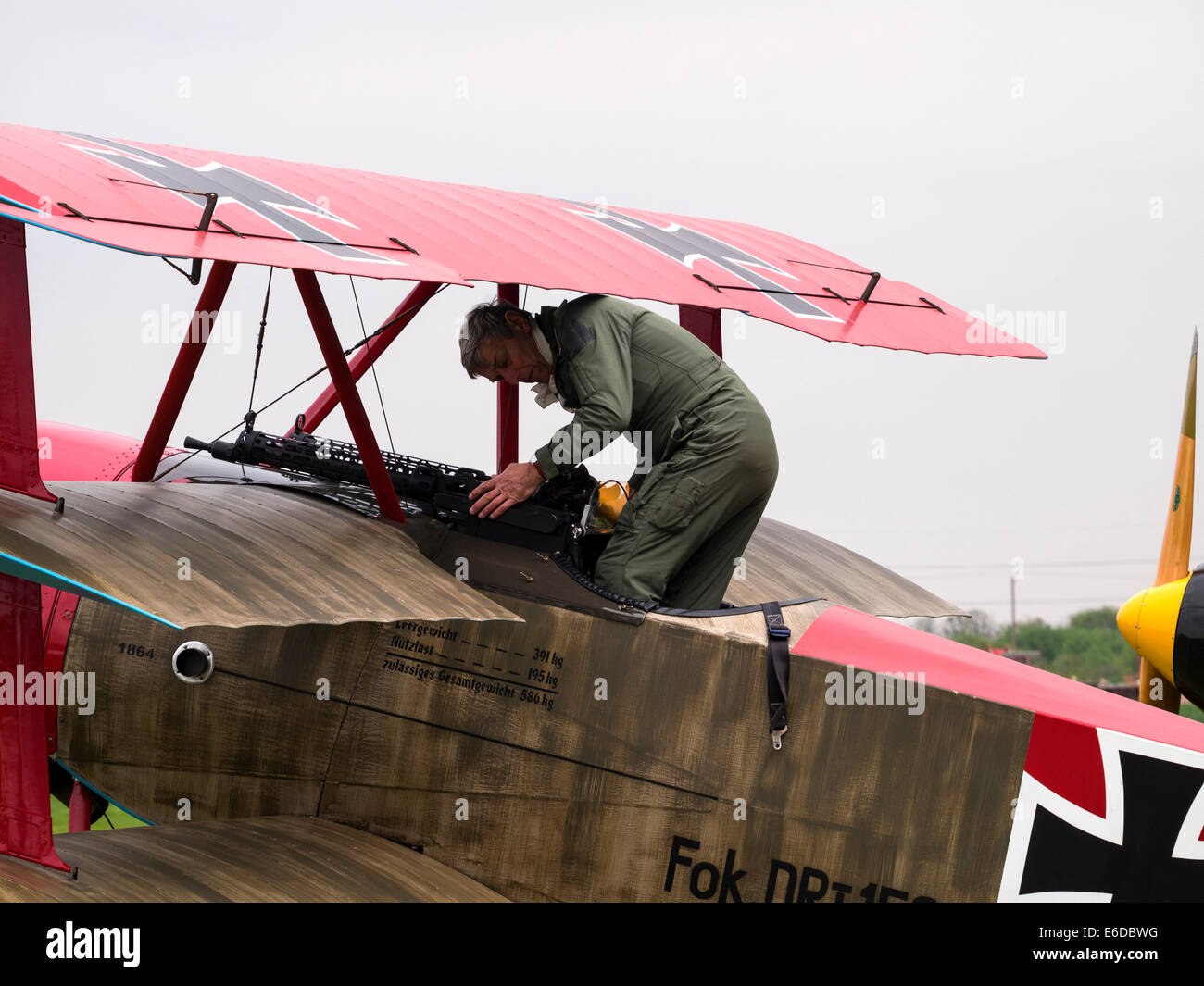 Pilot enters cockpit of A replica ww1 Fokker Triplane triplane aircraft ...