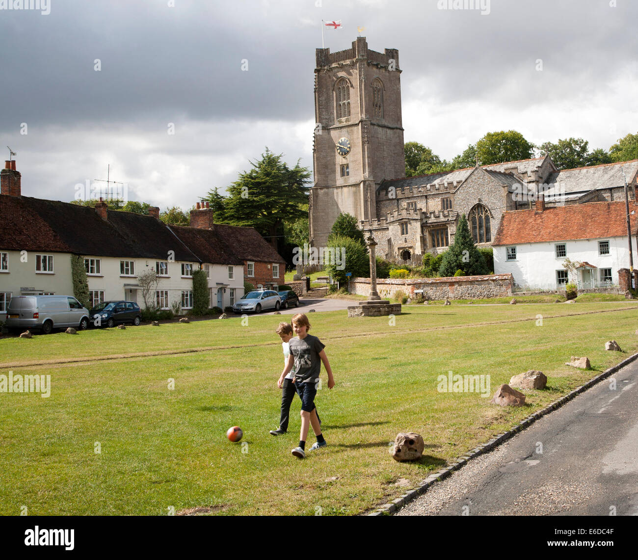 Church of St Michael and butter cross on the village green in Aldbourne ...