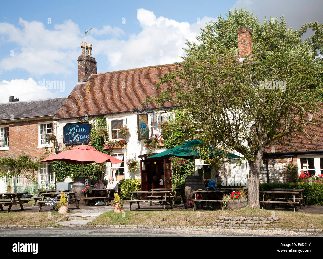 The Blue Boar pub on the village green in Aldbourne, Wiltshire, England ...